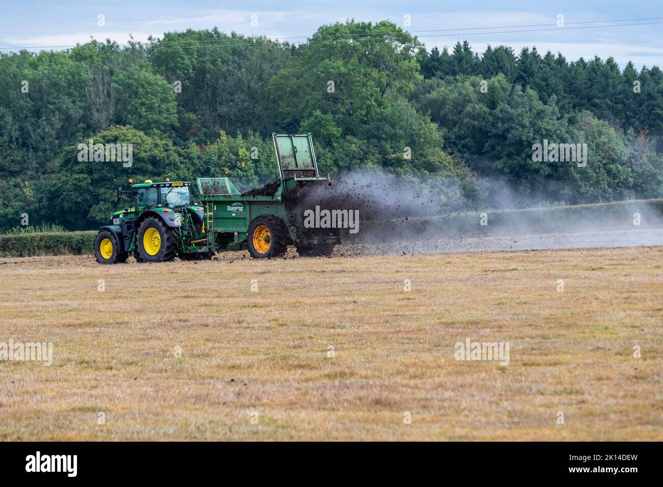 Modern agriculture. Muck spreading prior to ploughing Stock Photo - Alamy