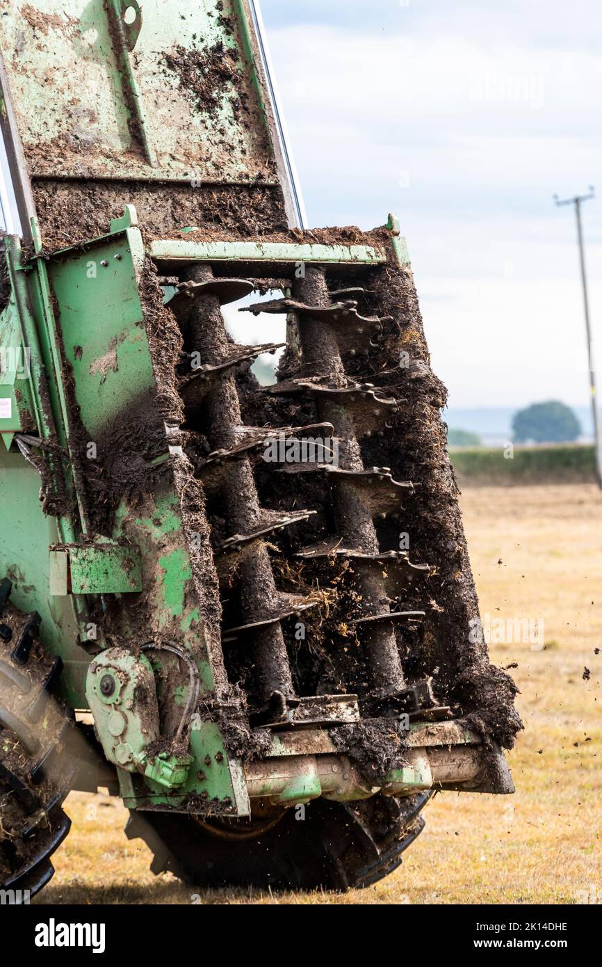 Modern agriculture. Muck spreading prior to ploughing Stock Photo - Alamy