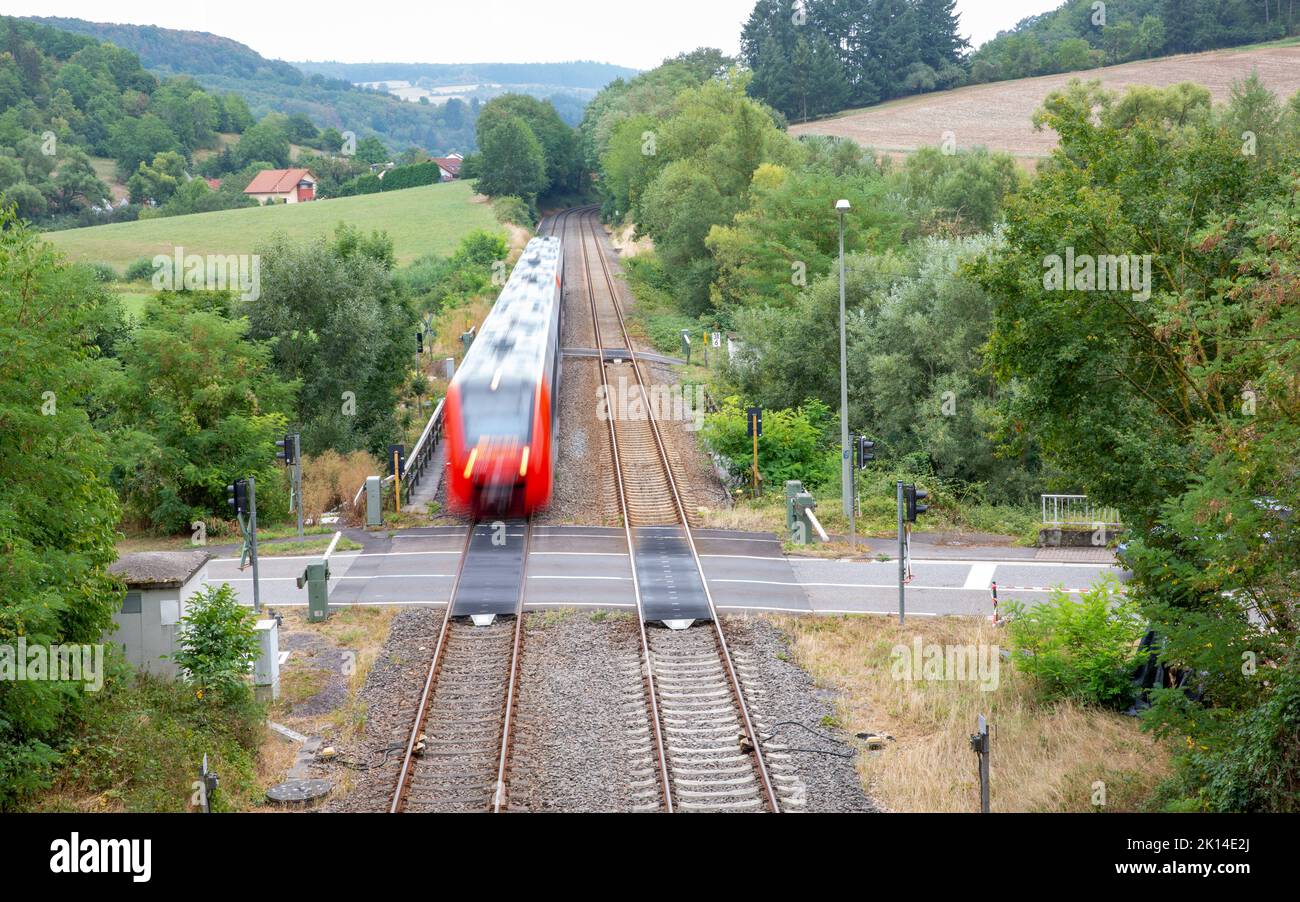 Approaching Local Train Crossing A Level Crossing With Barriers, Motion ...