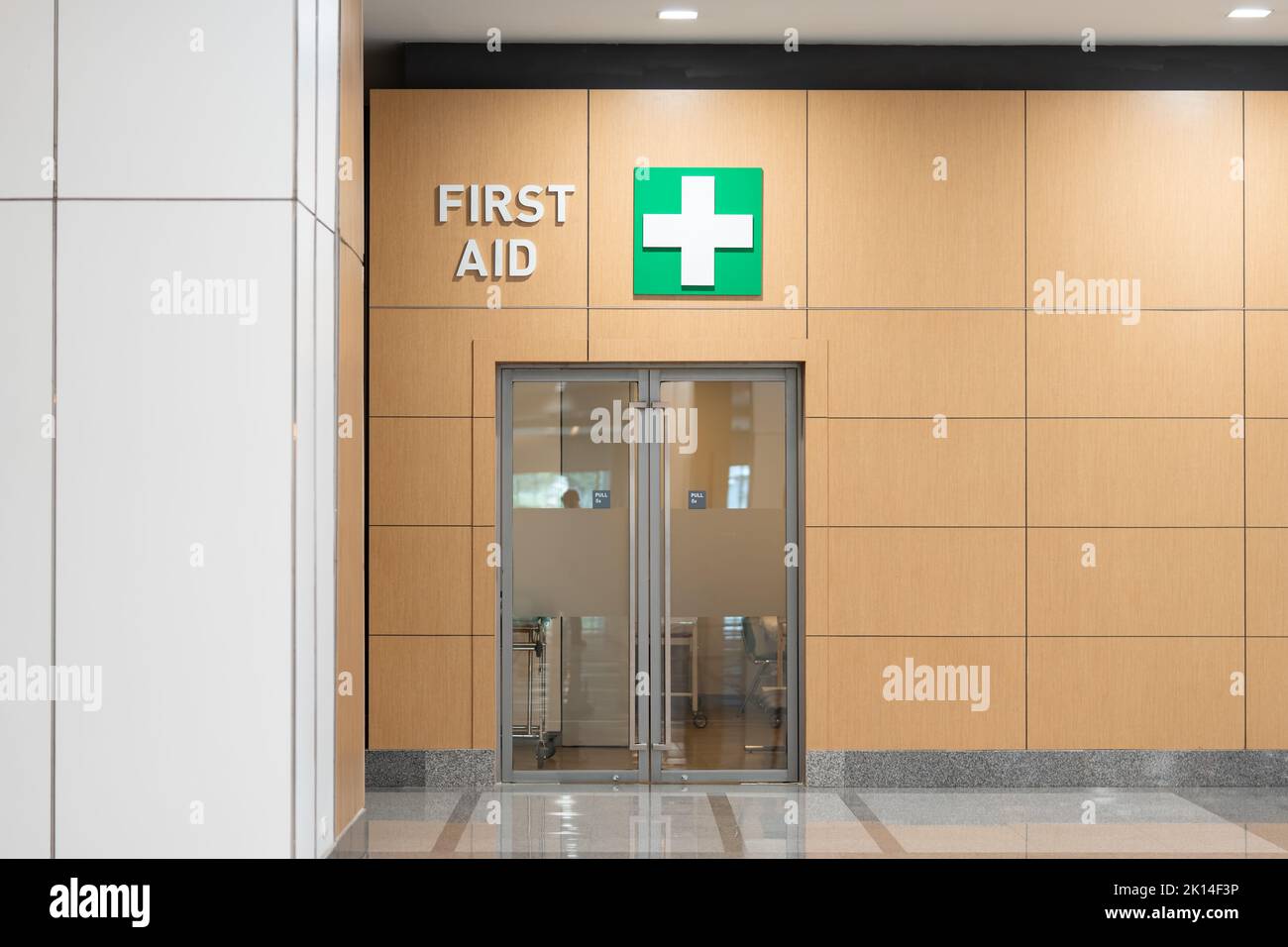 First Aid room inside a building. Decorated with pain light brown wall ...