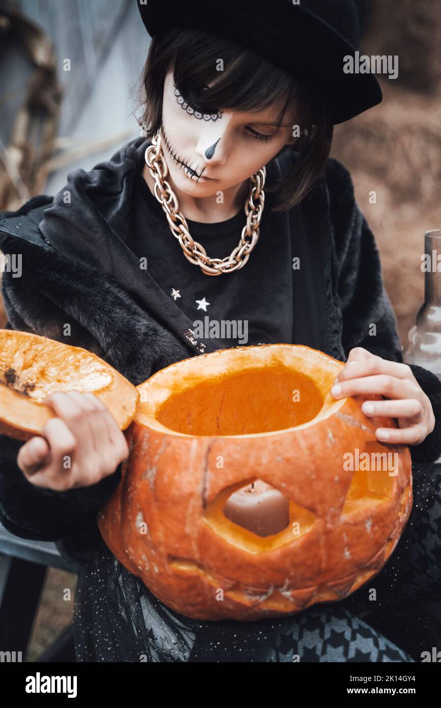 Beautiful scary little girl celebrating halloween. Terrifying black ...