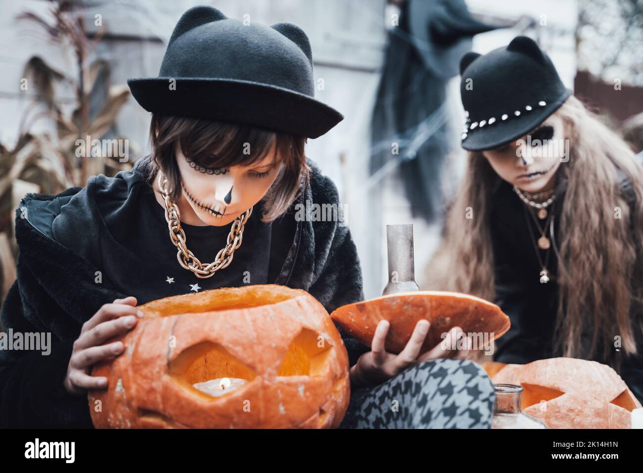 Beautiful scary little girls celebrating halloween. Terrifying black ...