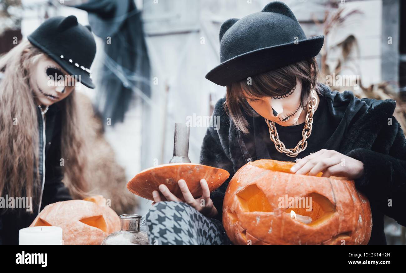Beautiful scary little girls celebrating halloween. Terrifying black ...