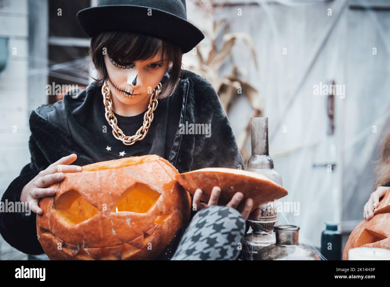 Beautiful scary little girl celebrating halloween. Terrifying black ...