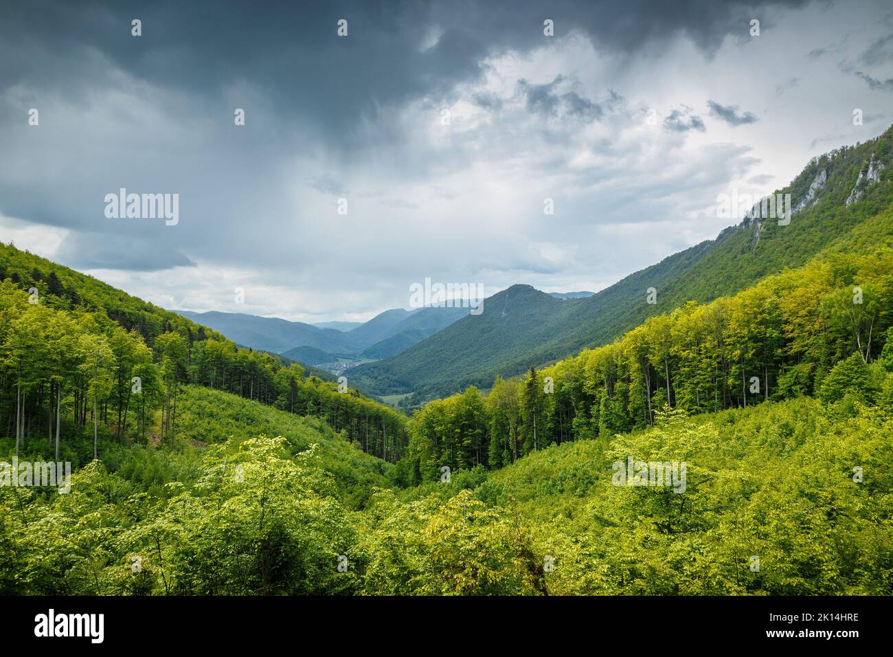 Spring cloudy landscape of hills and forests. The Muranska planina ...