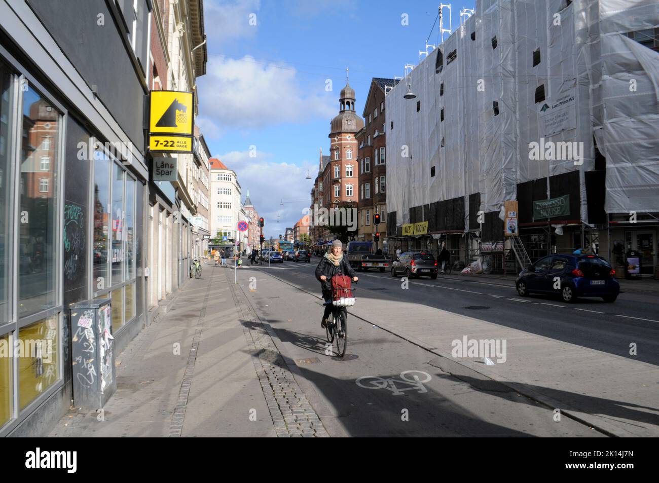 Copenhagen -Denmark -15 septmeber 2022-Perosn rides bike on Amgerbrogade indanish capital ...