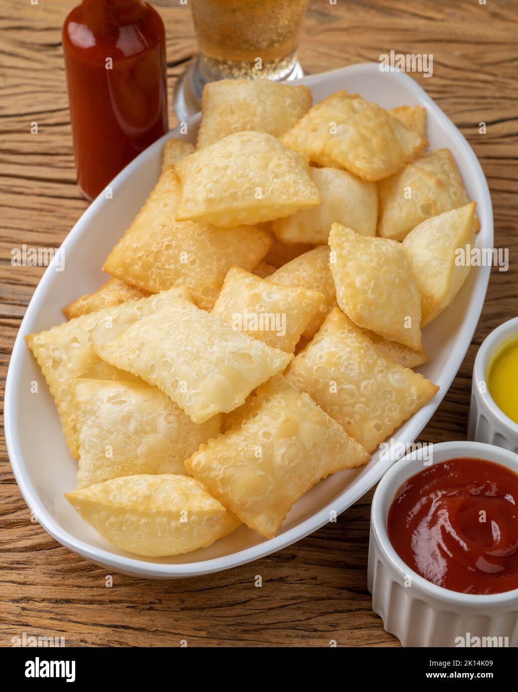 Pastel, typical brazilian finger food over wooden table Stock Photo - Alamy