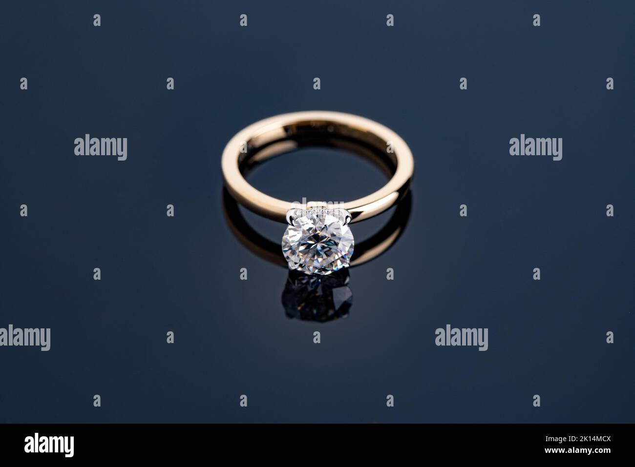 Solitaire Wedding Ring With Diamond on Reflected Background Stock Photo ...