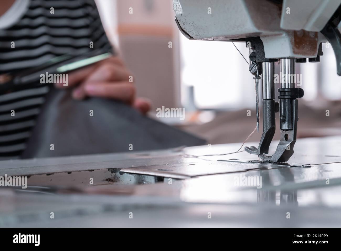 Sewing machine needles close-up in the workshop Stock Photo - Alamy