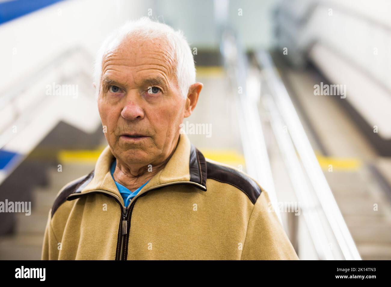 Portrait of old man going to metro station Stock Photo - Alamy