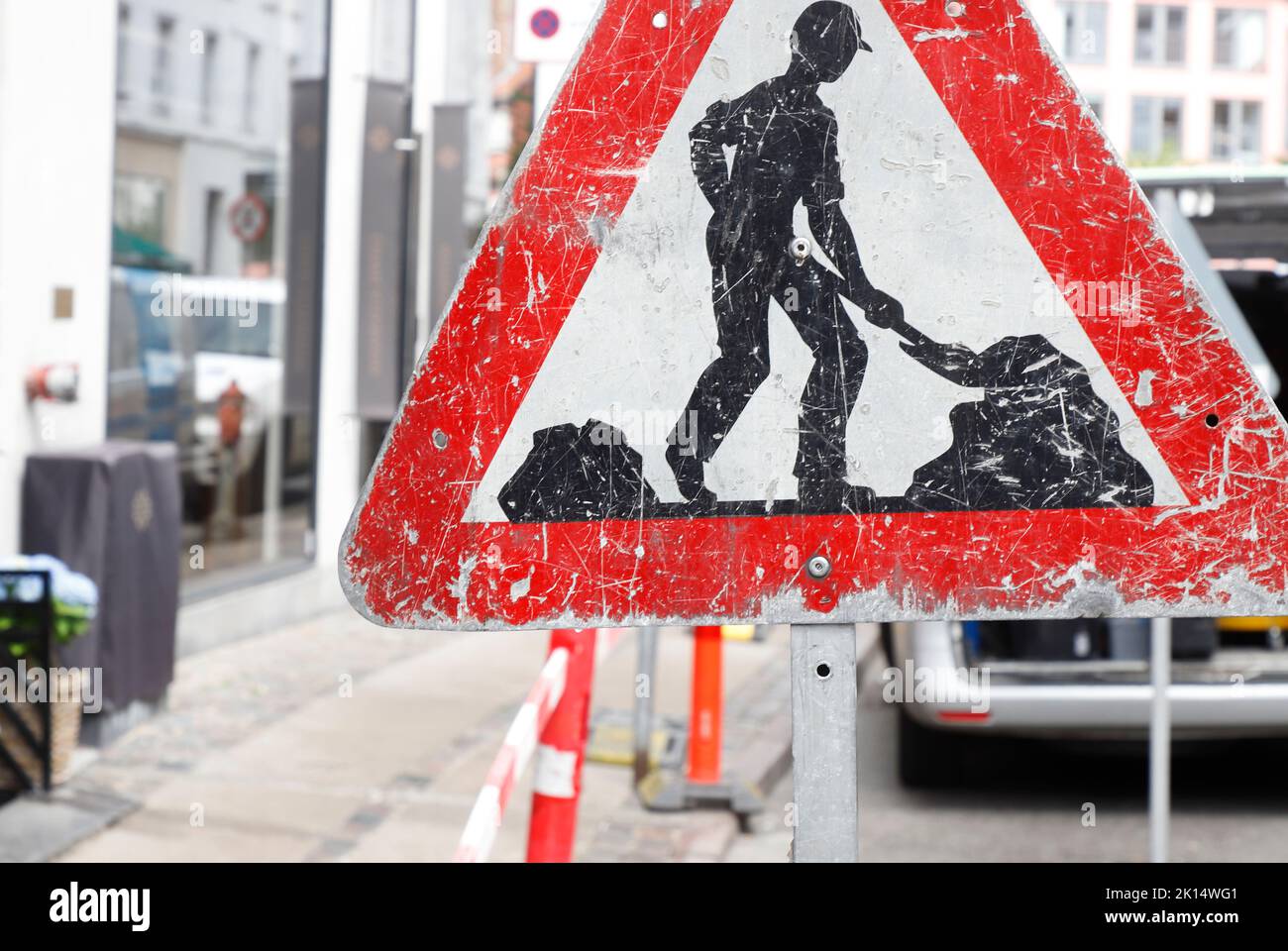 Roadwork sign in a city street Stock Photo - Alamy