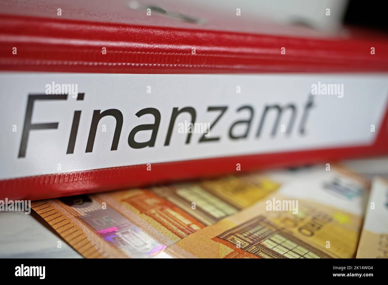 Closeup of isolated red file folder with german word Finanzamt (engl ...