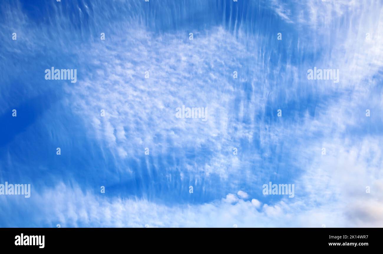 Beautiful isolated blue summer cloudscape, wind blown washed rippled ...