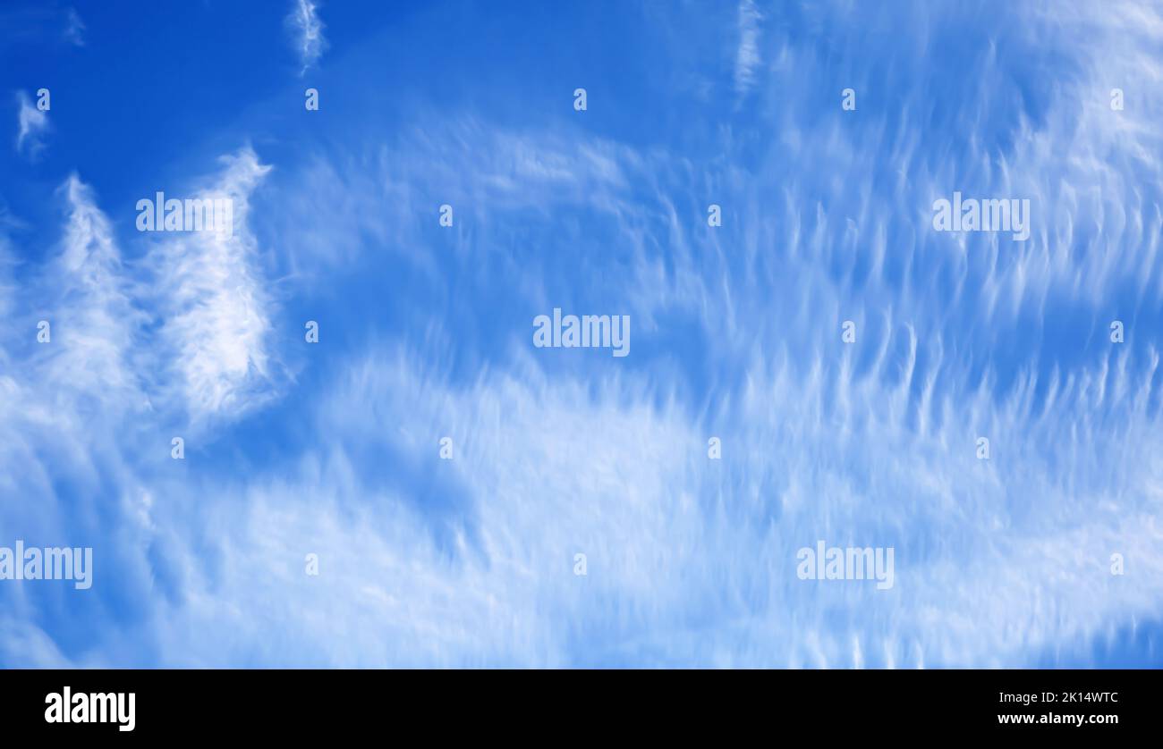 Isolated beautiful cloudscape, clear blue summer sky, mix of different ...