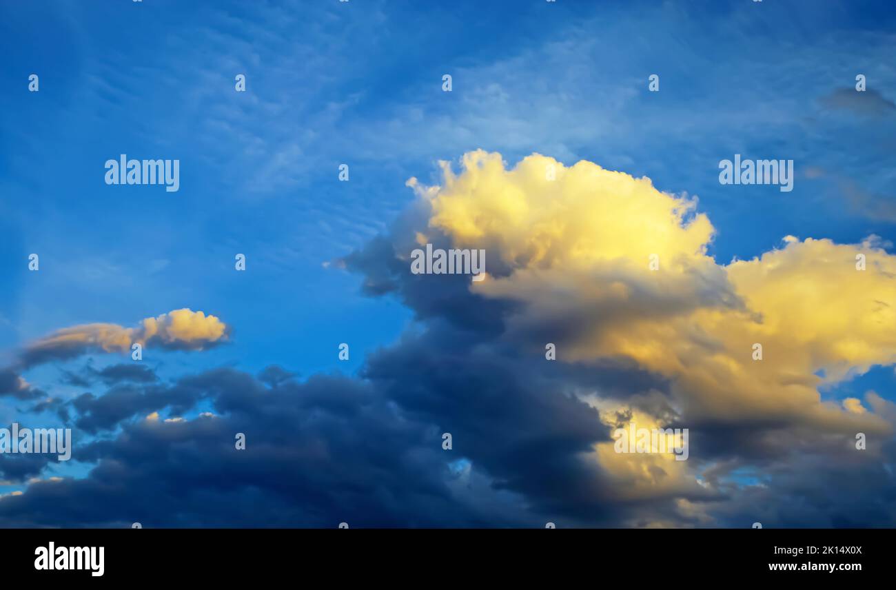 Isolated fluffy cloudscape background, blue summer sky, white towering cumulus congestus storm ...