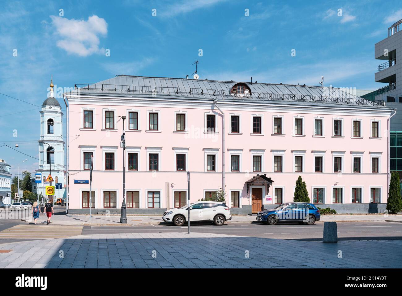 Shkolnaya Street, an old three-story building from 1890, the bell tower ...