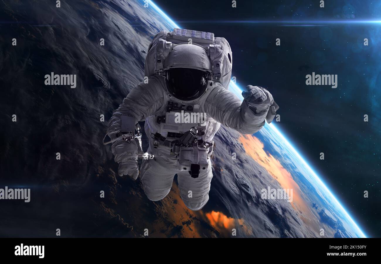 Astronaut on space walk. Orbit of the planet Earth. Solar system Stock ...