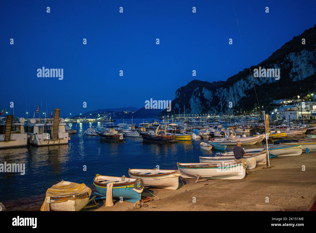 Capri island, the dock of Marina grande by night Stock Photo - Alamy