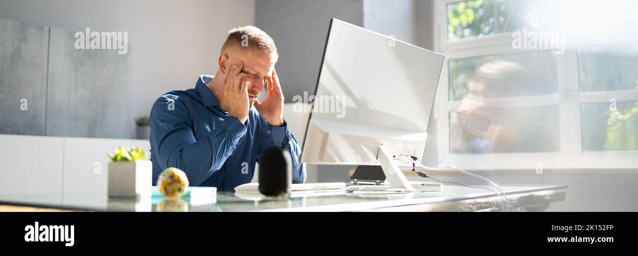 Stressed Sick Employee Man At Computer With Pain Stock Photo - Alamy