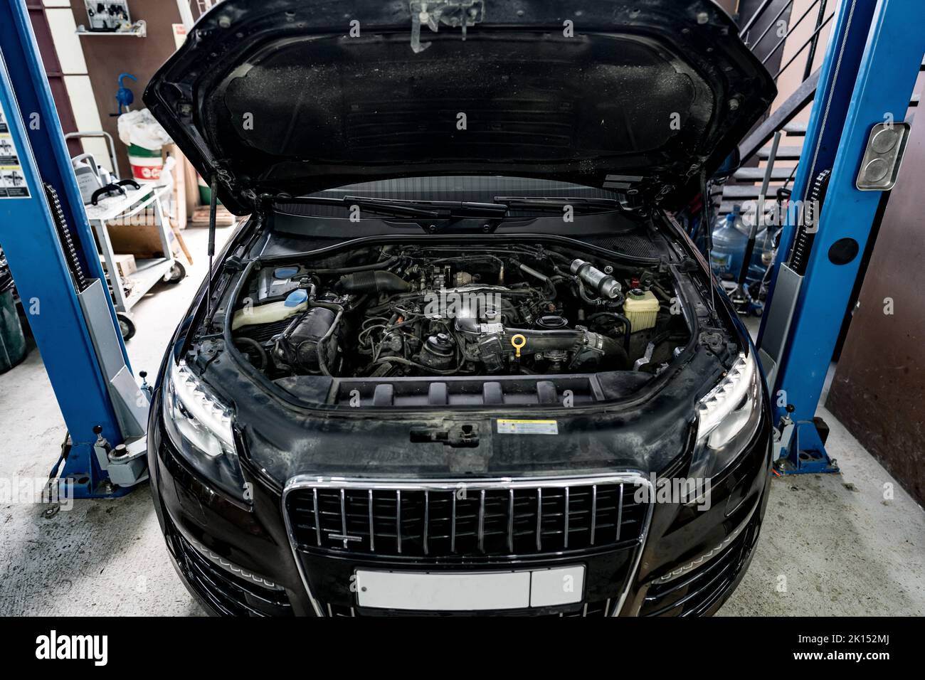 View of engine and other parts under the open hood of a car Stock Photo ...