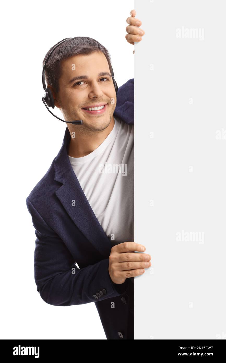 Young man with a headset standing behind a blan white board isolated on white background Stock ...