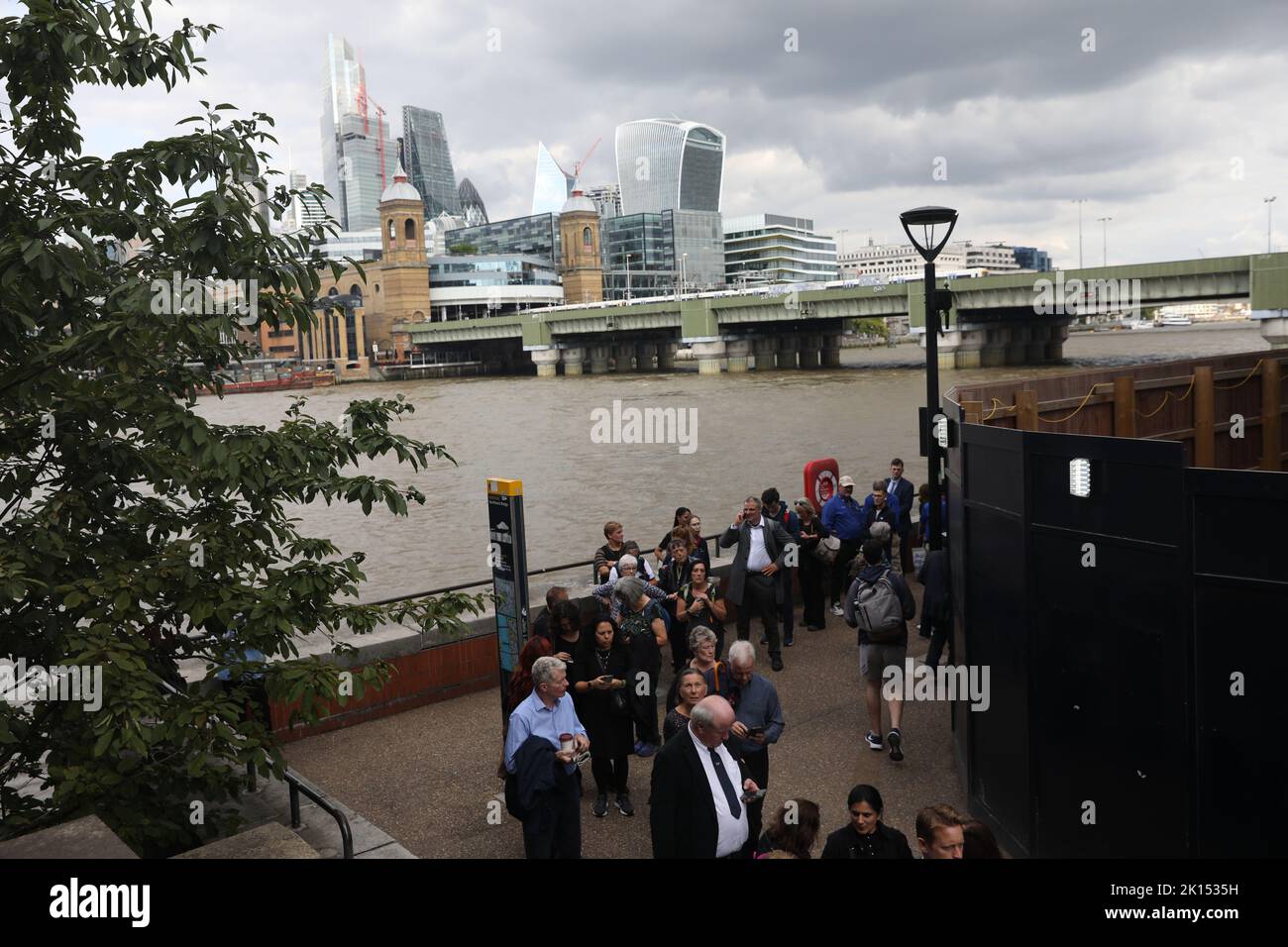 London, UK. 15 September, 2022. People walk in a queue by the southbank ...
