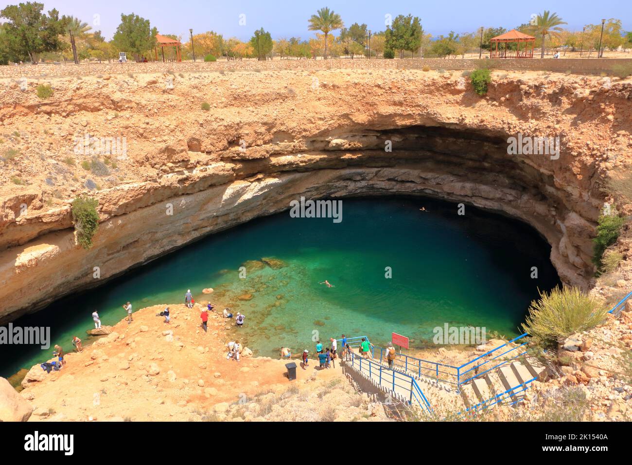 March 22 2022 - Bimmah sinkhole, Oman: People enjoy one of the world ...