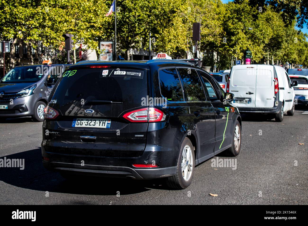 Paris, France - September 14, 2022 Taxi driving through the streets of ...