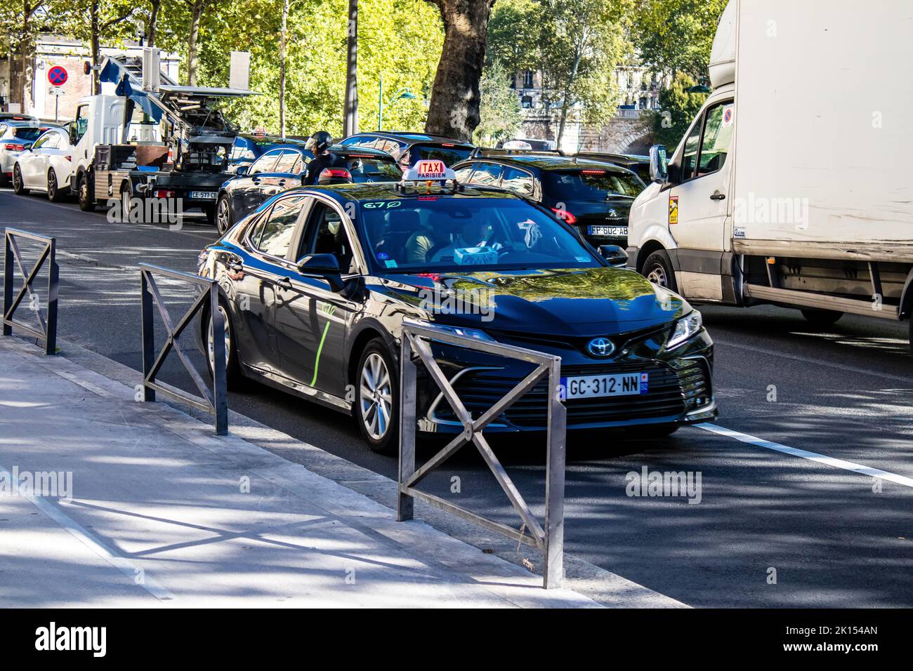 Paris, France - September 14, 2022 Taxi driving through the streets of ...