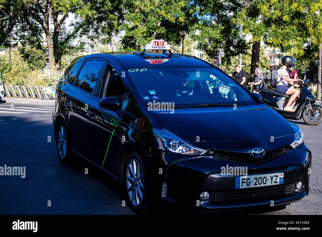 Paris, France - September 14, 2022 Taxi driving through the streets of ...