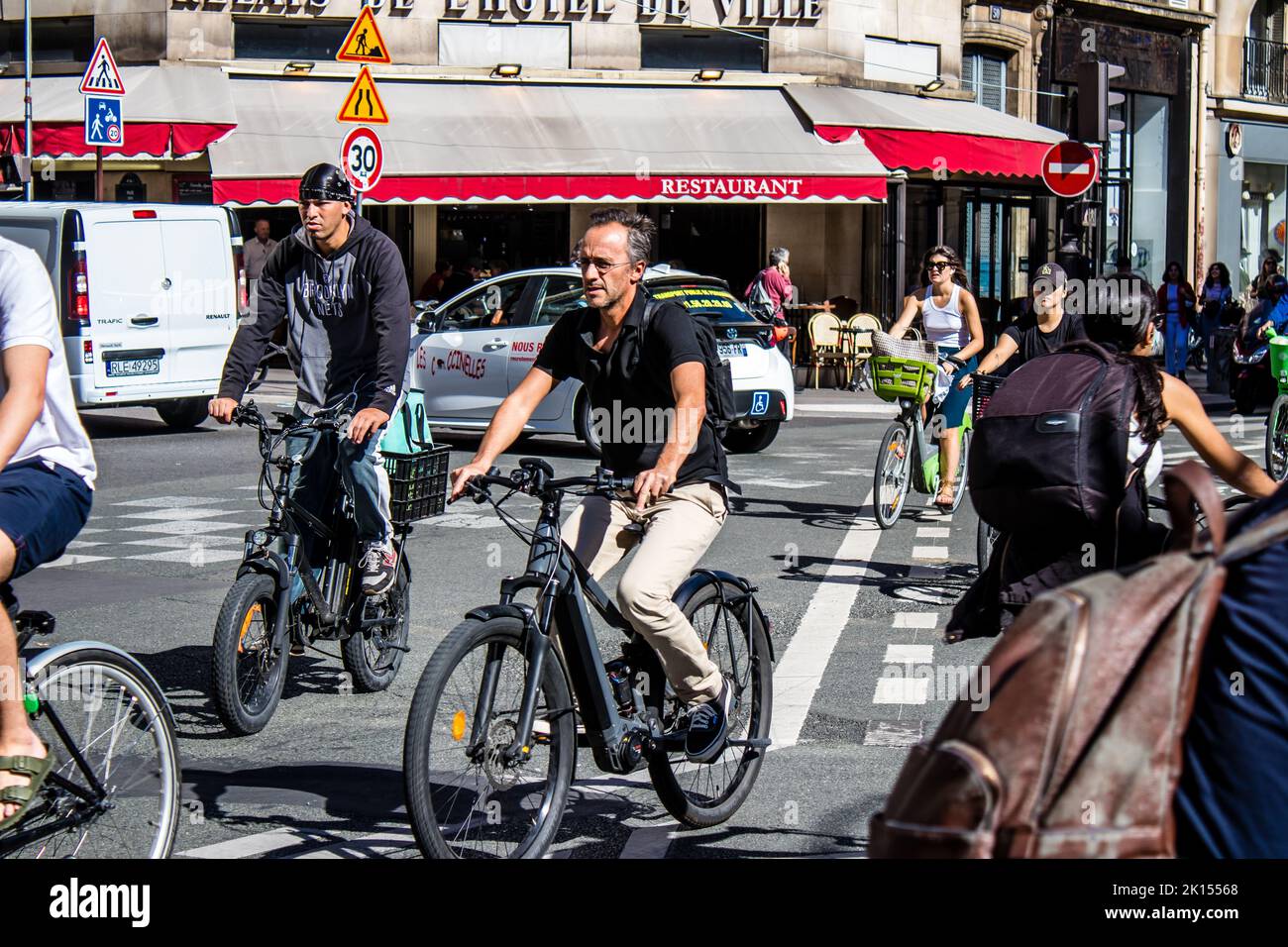 Paris, France - September 12, 2022 People cycling on the streets ...