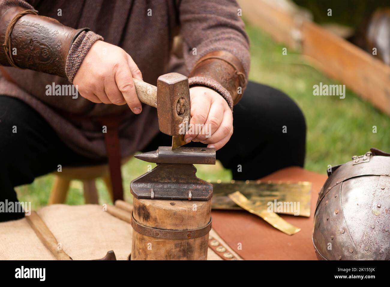 Close up of man's hands of a medieval blacksmith re-enactment of 4th ...