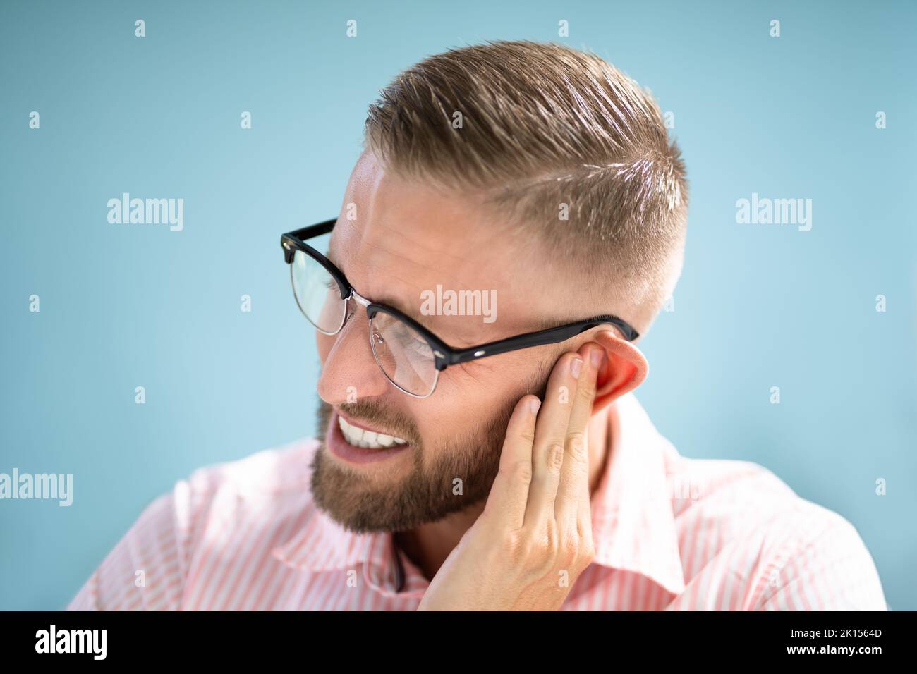 Earache And Pain. Unhappy Man With Otitis Externa Stock Photo - Alamy