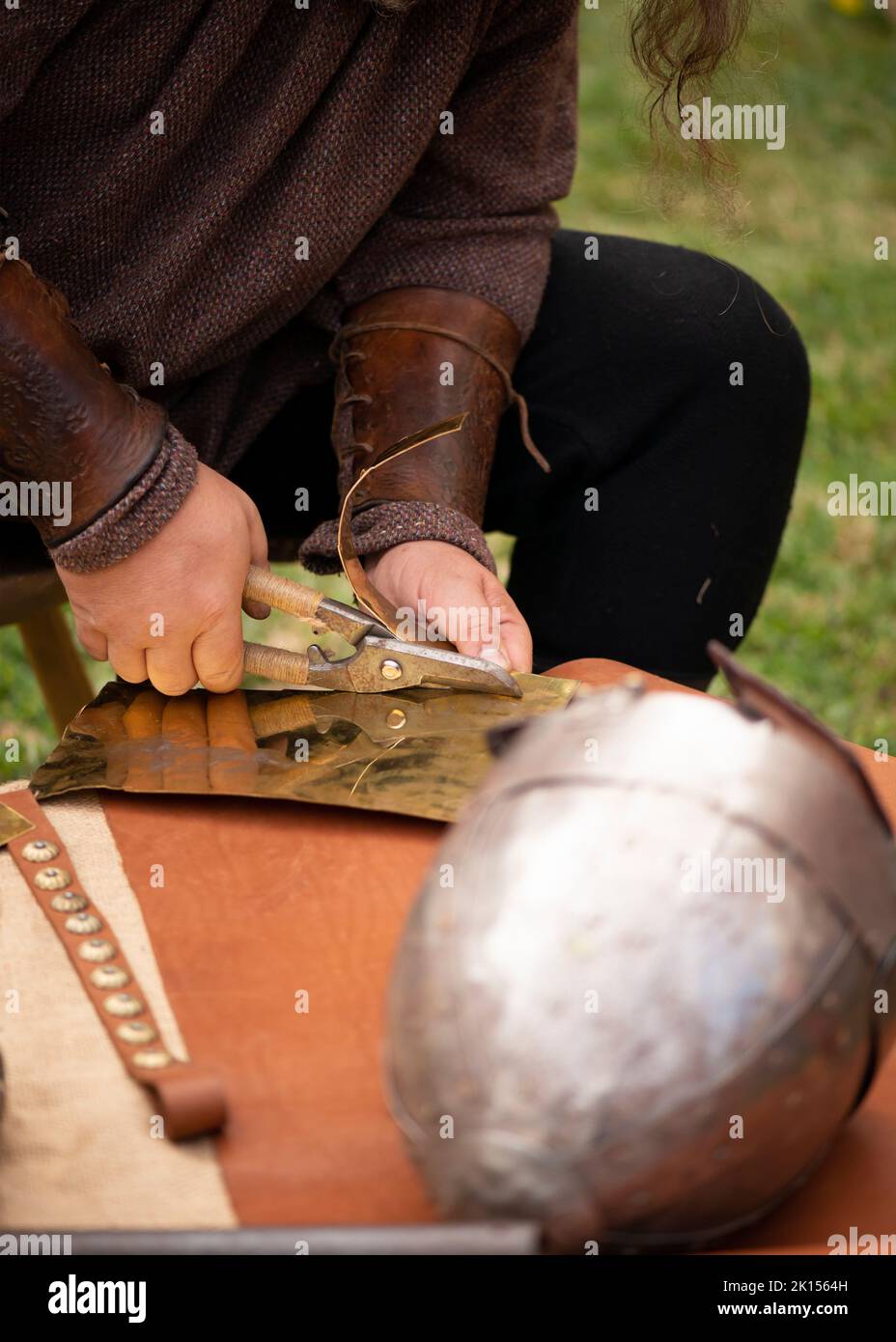 Close up of man's hands of a medieval blacksmith reenactment of 4th ...