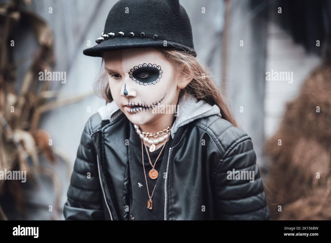 Beautiful scary little girl celebrating halloween. Terrifying black ...