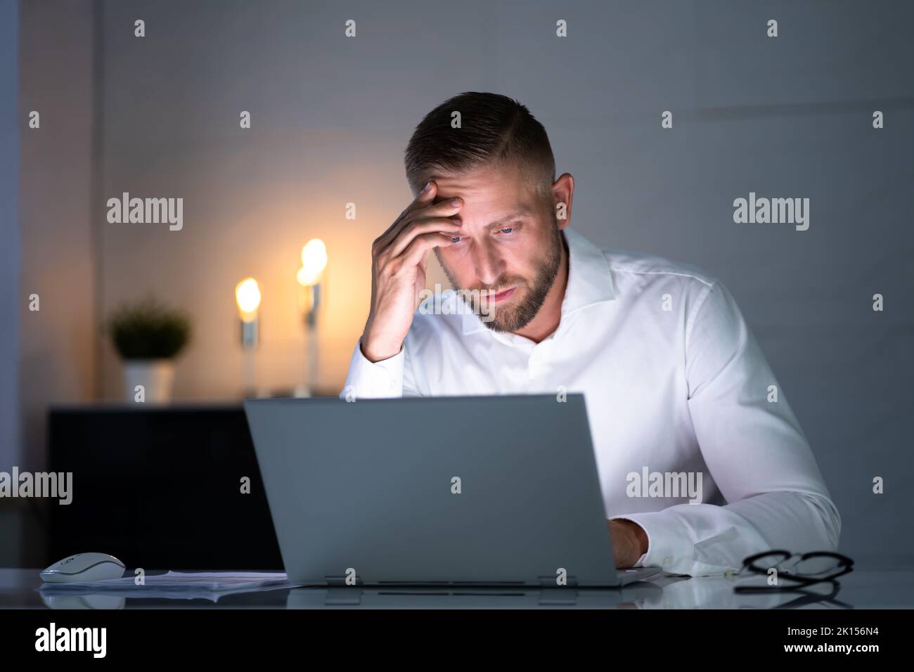 Stressed entrepreneur working on laptop hi-res stock photography and ...