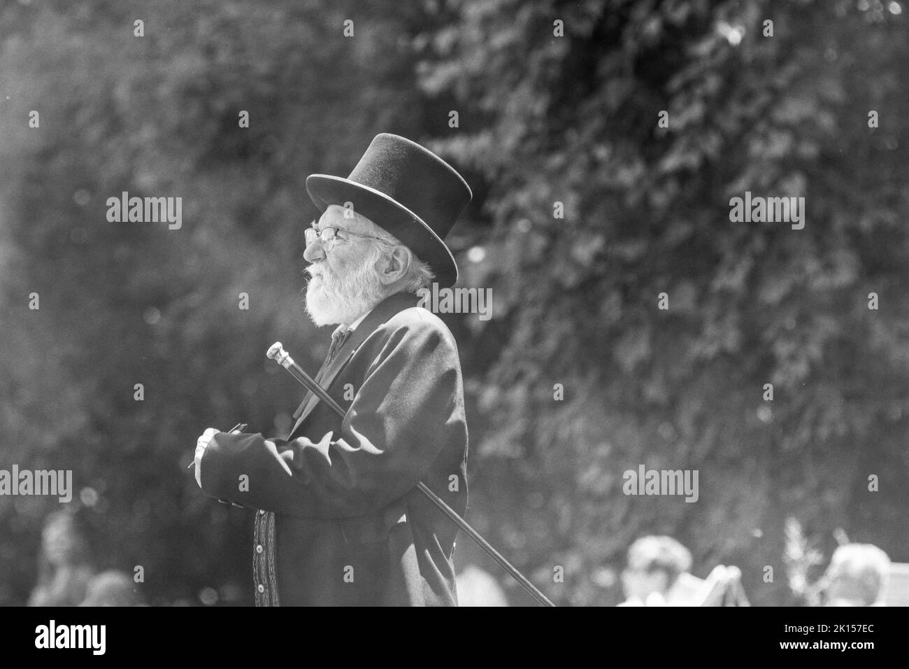 An Umpire dressed in a top hat and tails officiates a baseball game ...