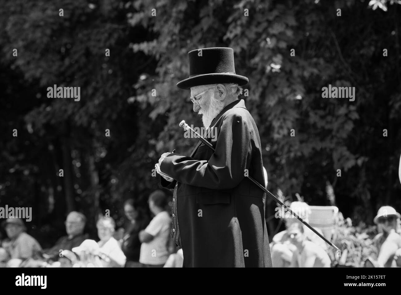 An Umpire dressed in a top hat and tails officiates a baseball game ...