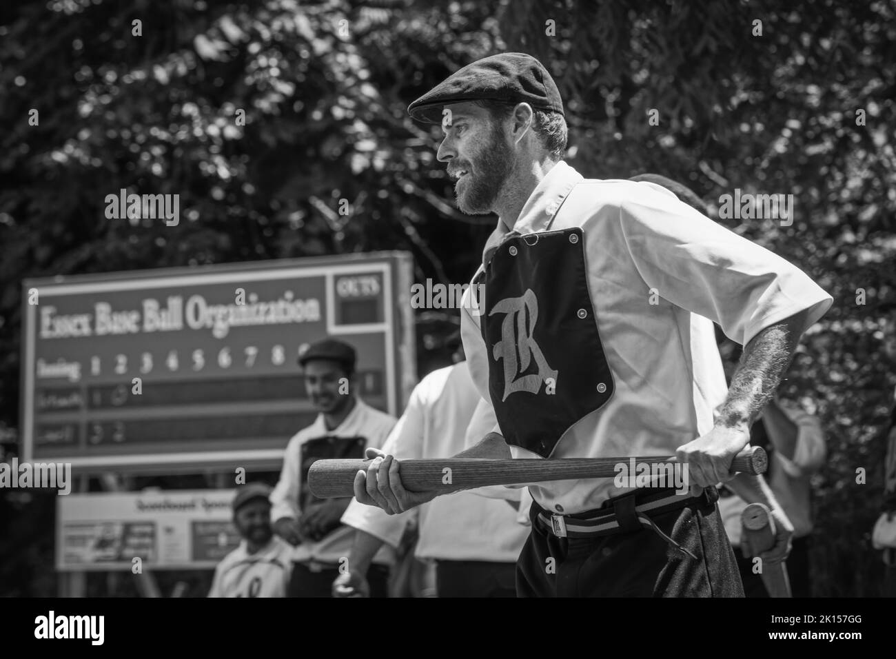 A player stands ready to take his place at the plate. Vintage baseball ...