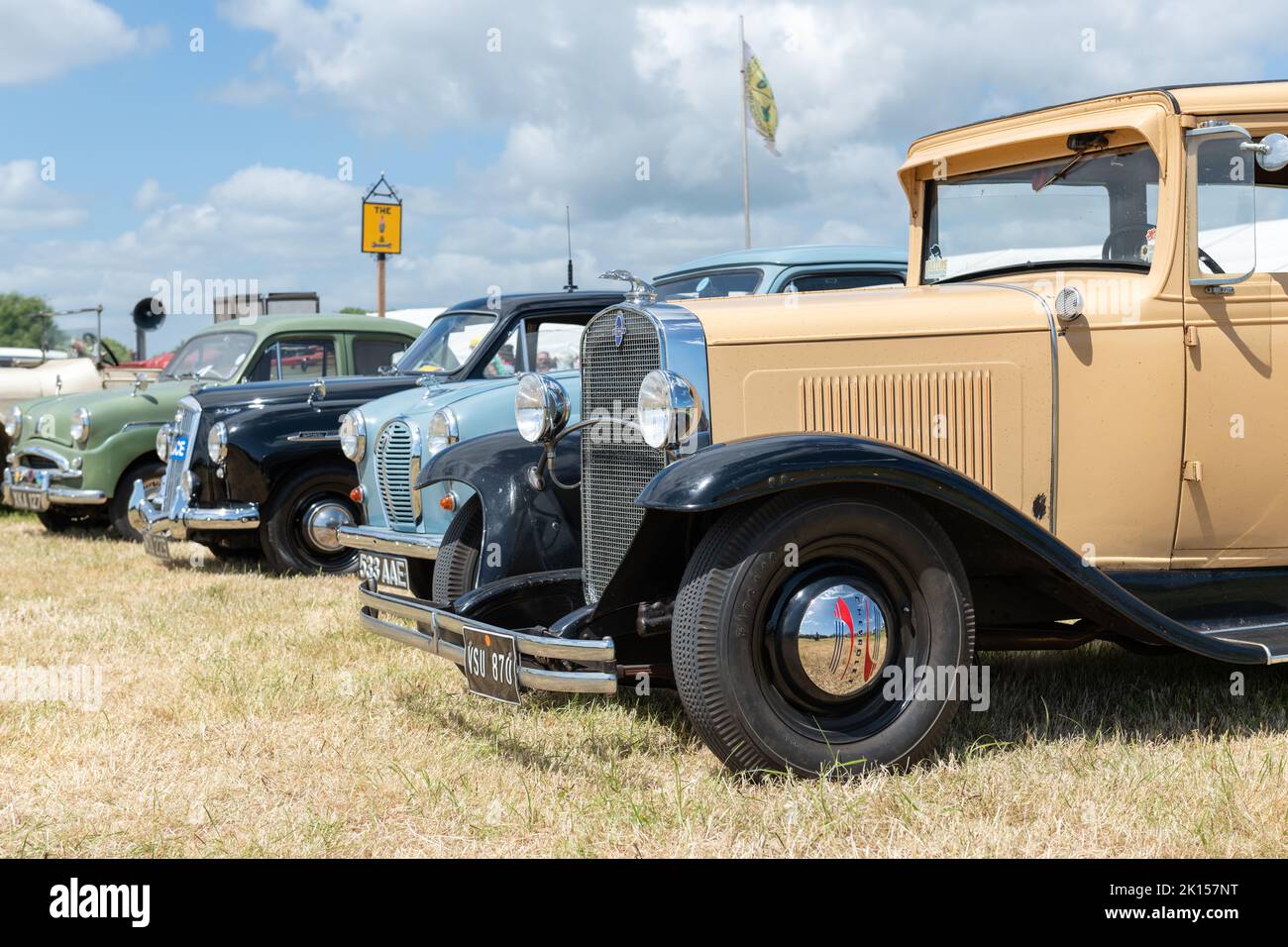 West Bay.Dorset.United Kingdom.June 12th 2022.A row of vintage cars are ...