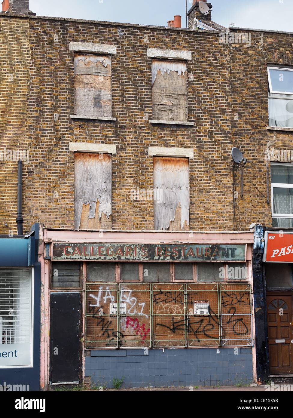 A derelict and rundown disused restaurant and building in London Stock ...