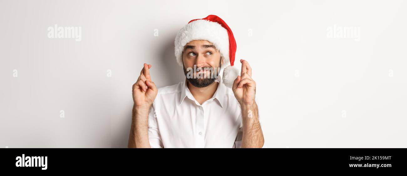Party, winter holidays and celebration concept. Happy man in santa hat ...