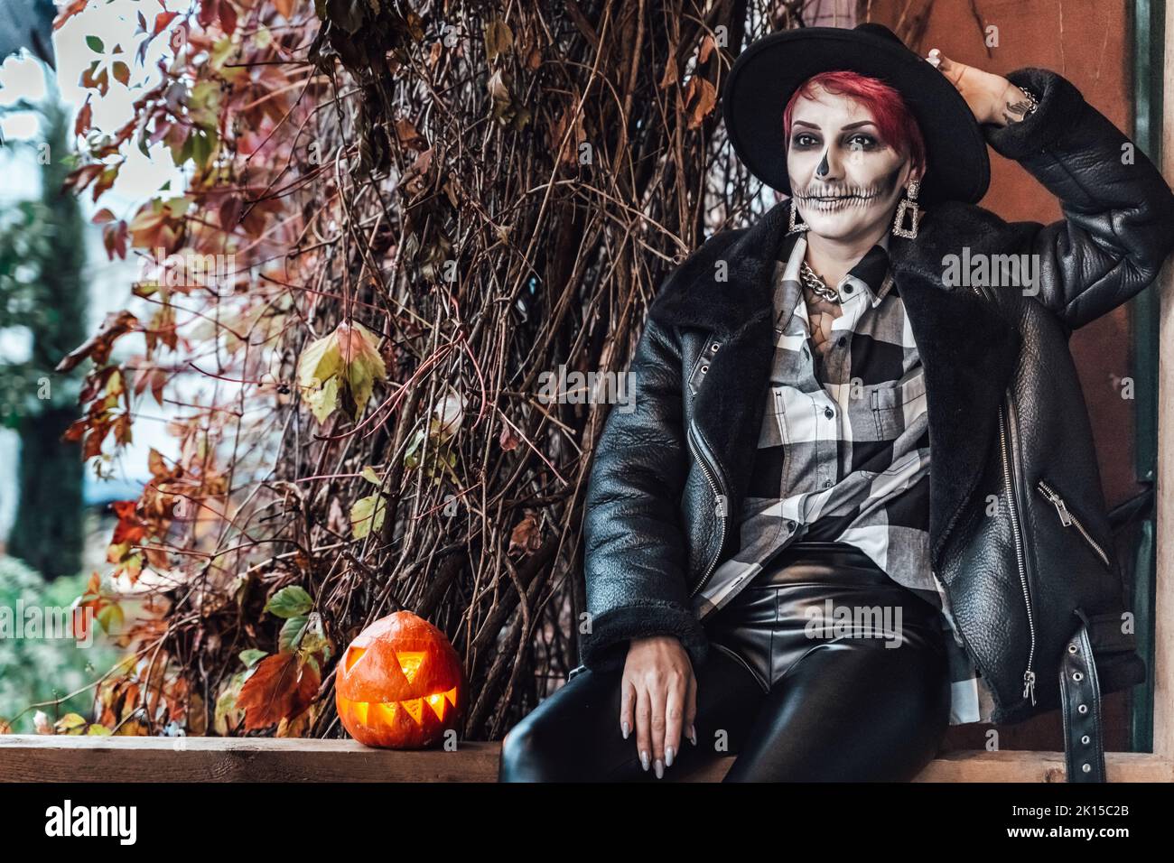 Scary woman,girl celebrating halloween.Terrifying black skull half-face ...