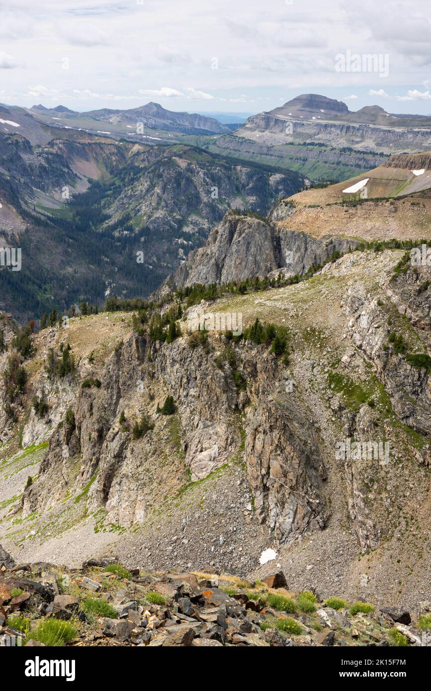 Steep alpine cliffs rising high above the lower elevations of Death ...