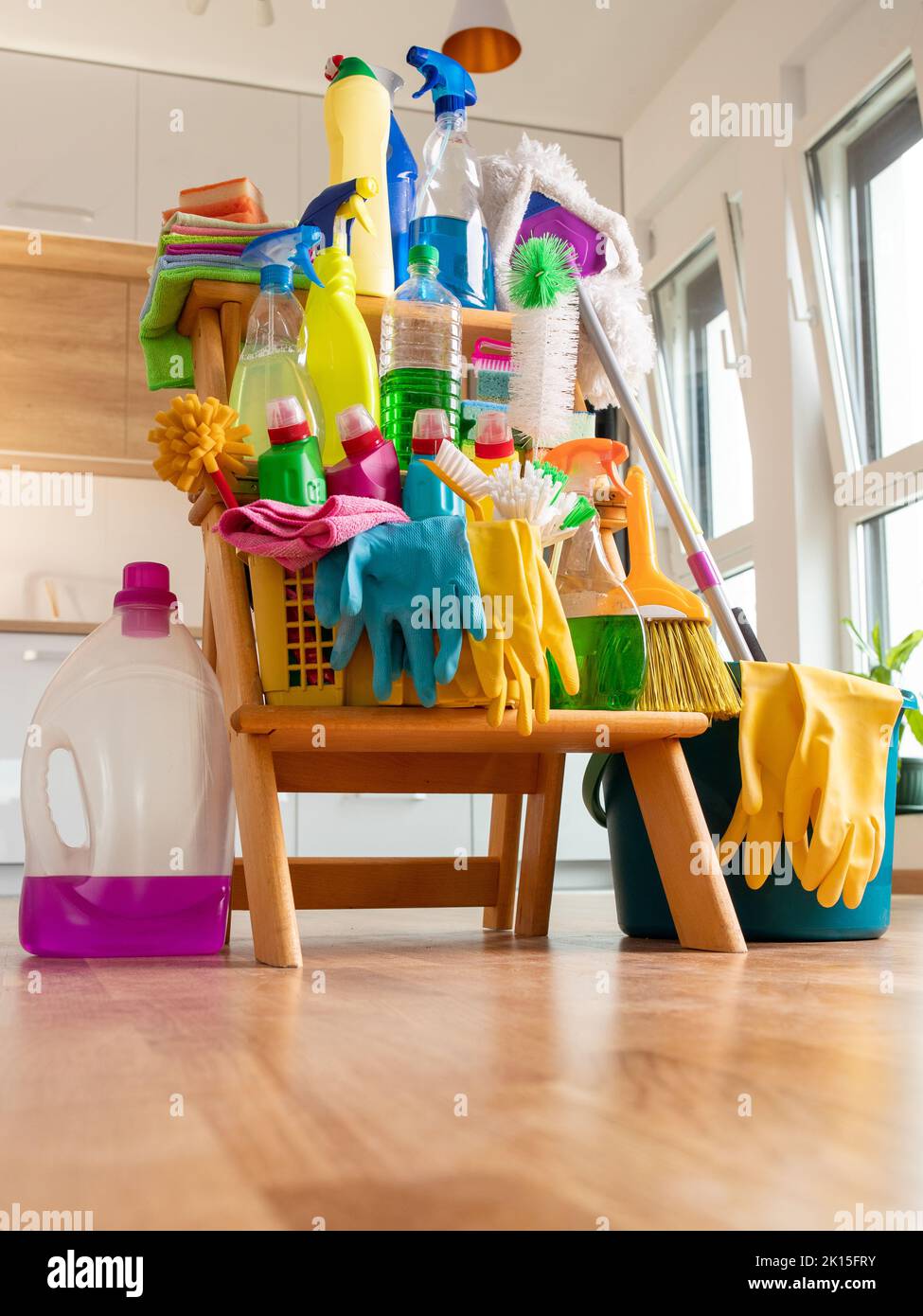 Close up of cleaning products arranged on wooden shelves in front of ...