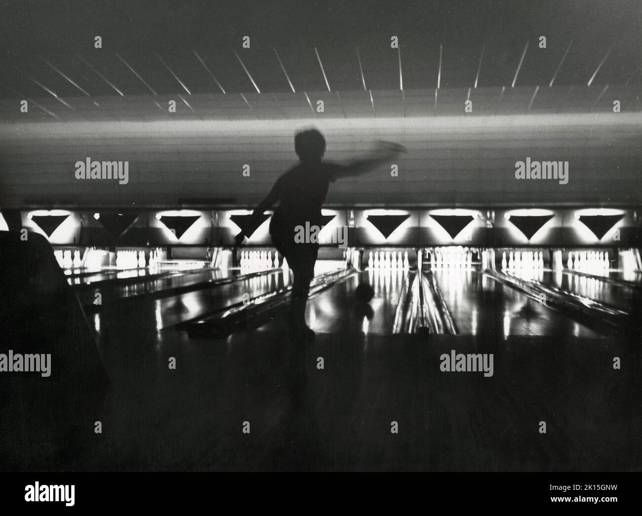 A bowler at a bowling alley Stock Photo - Alamy