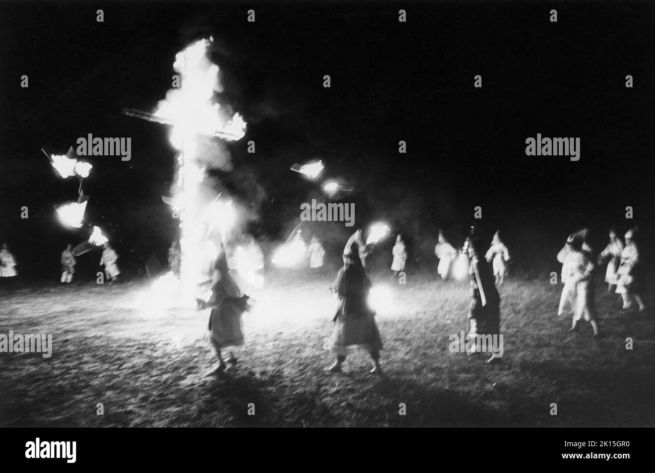 Salisbury, NC, 1965: Klansmen light a cross which had been erected ...