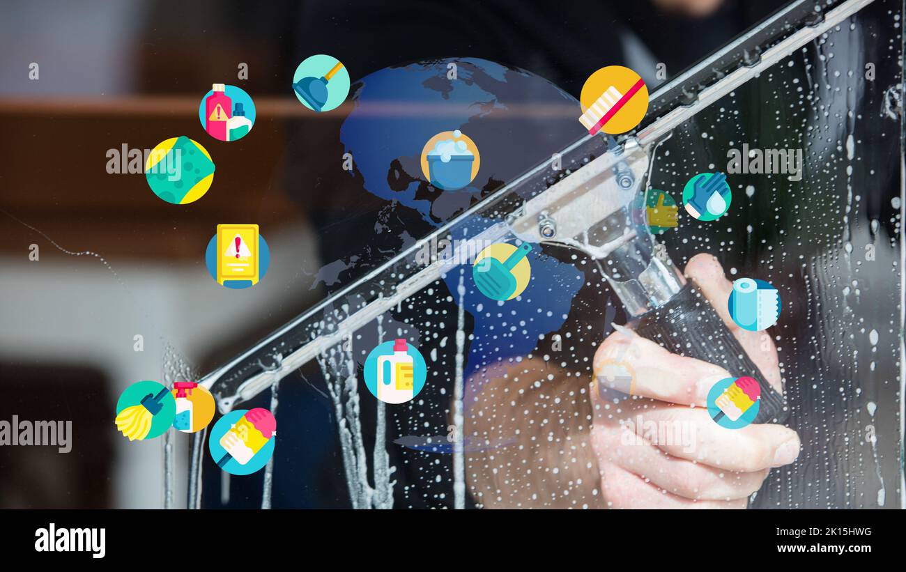 Window cleaner cleans window with foam and puller Stock Photo - Alamy