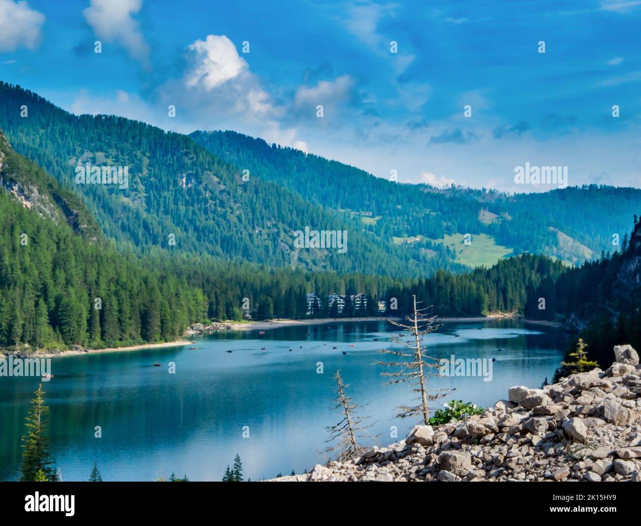 The beautiful blue and clear Lago di Braies lake in the Dolomites below ...