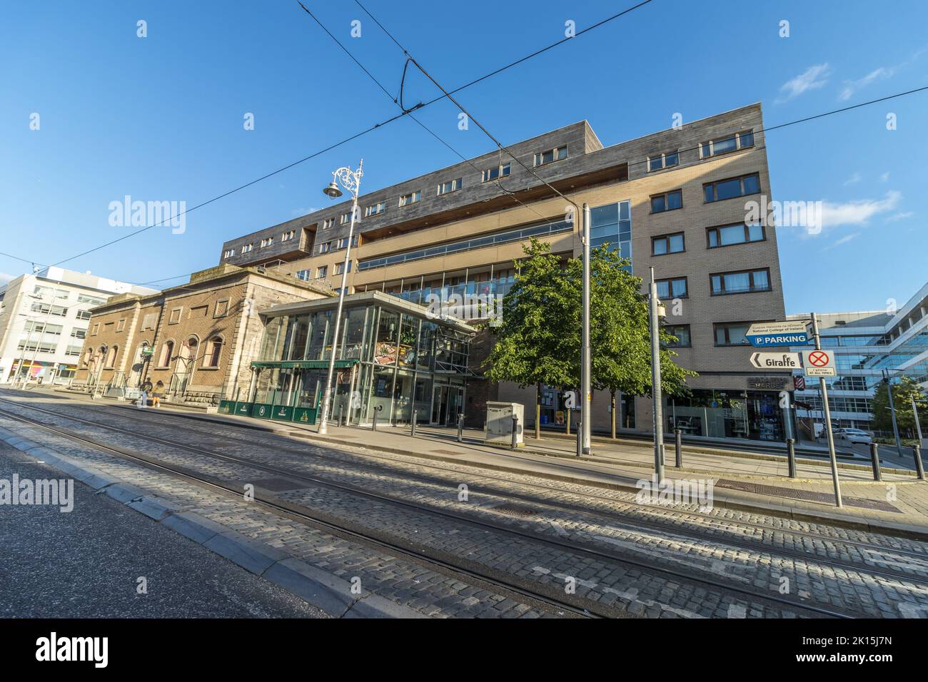 A view of old and modern buildings and tramways in Dublin Docklands ...